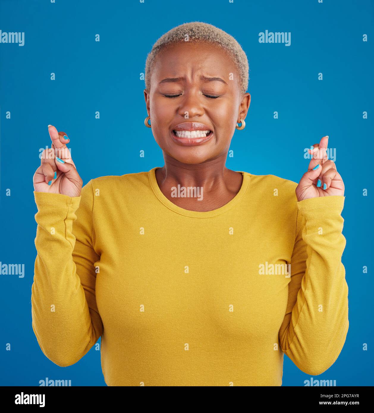 Nervous, fear and fingers crossed by desperate black woman isolated ...