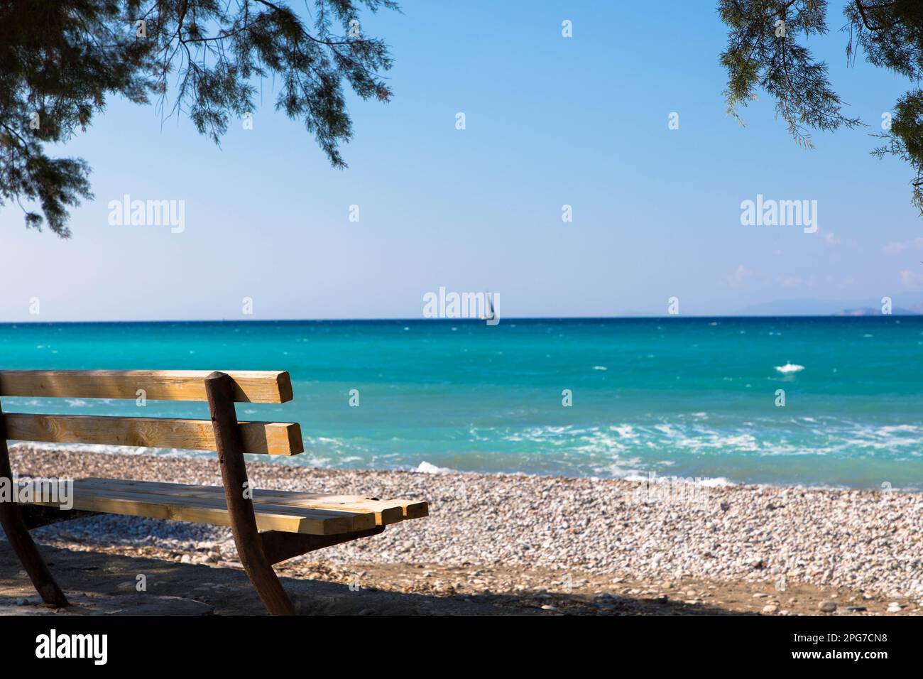 Panoramic view of the deserted Amiros beach with wooden bench in the ...
