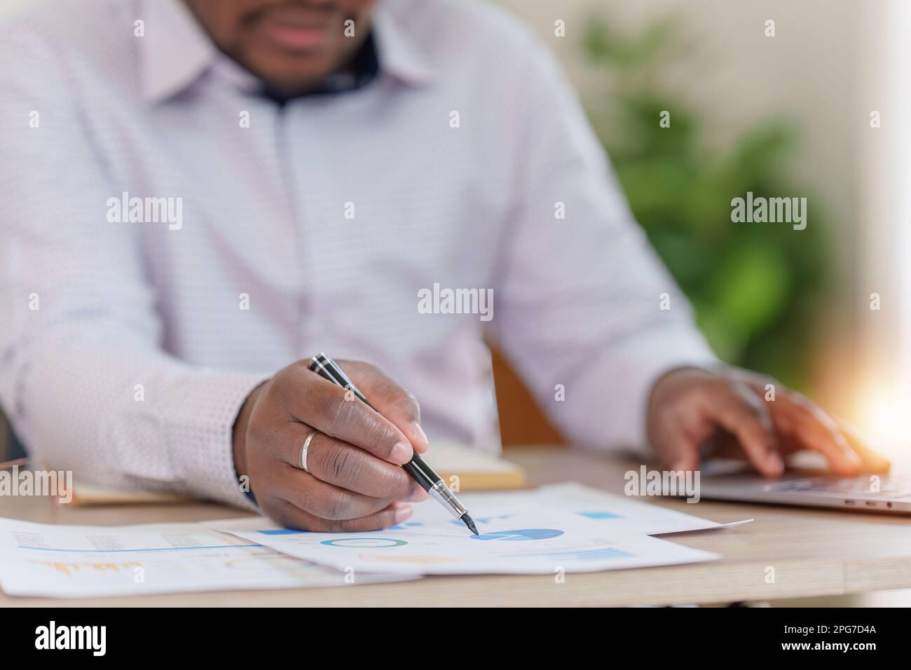 Smiling American African makes financial report and studies annual ...