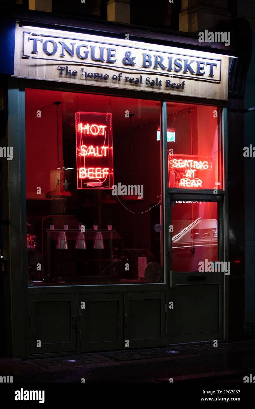 A salt beef shop called Tongue and Brisket taken at night in Wardour ...