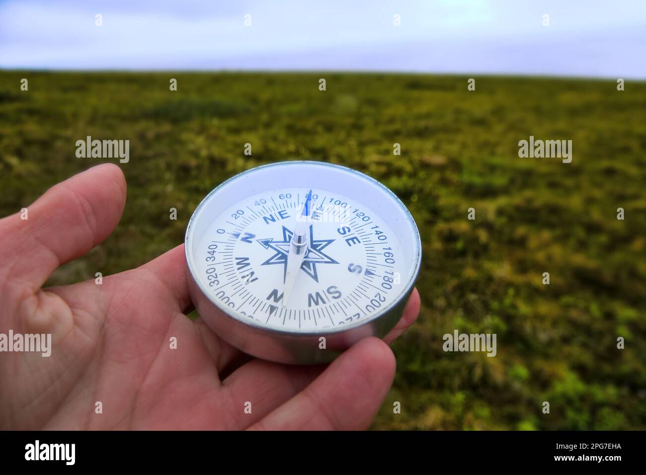 On the edge of farmland. Hiking through the fields with compass Stock ...