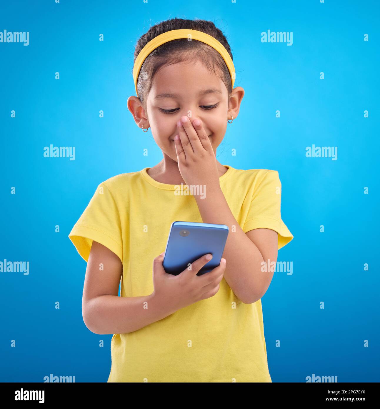 Phone, smile and child laugh on blue background for social media, funny ...