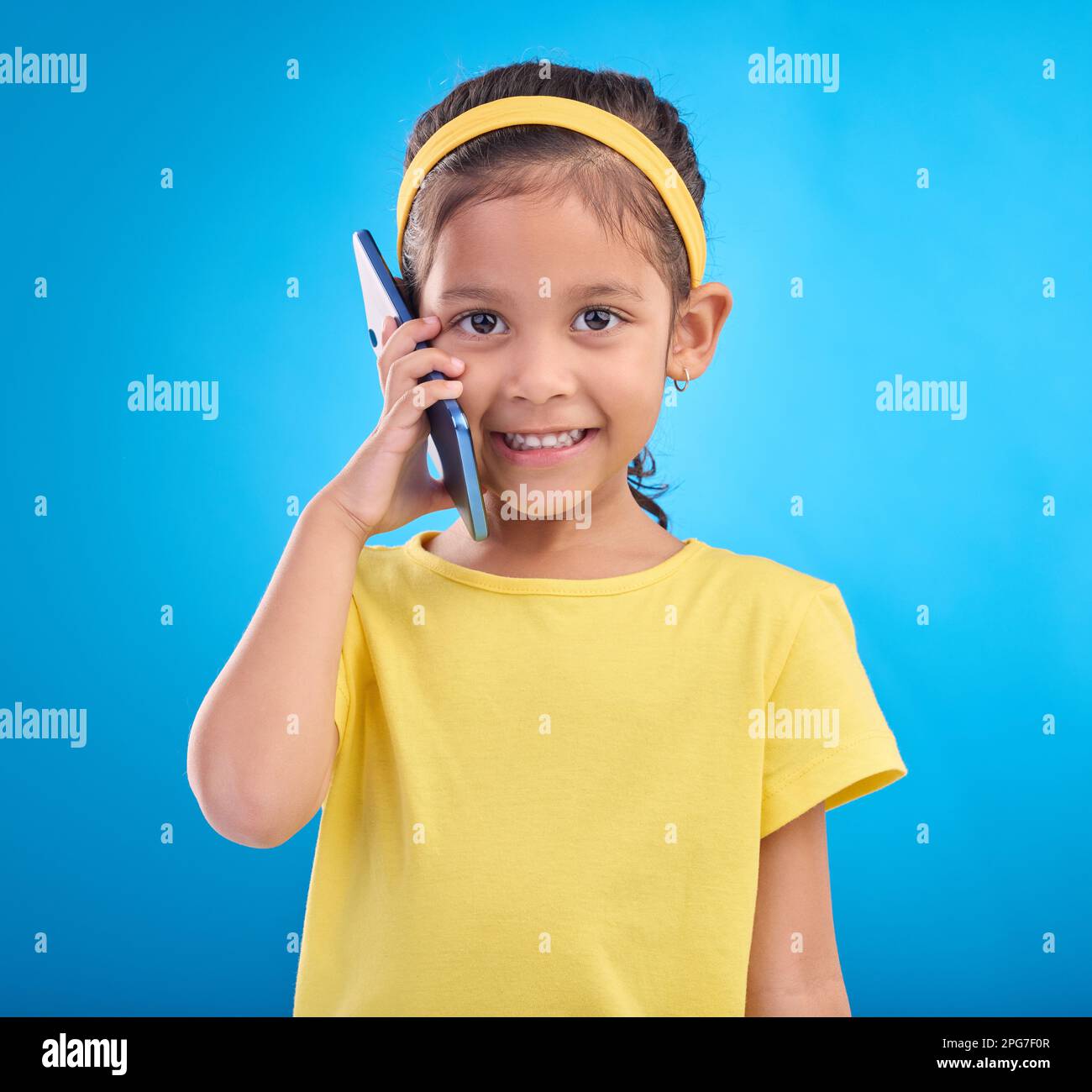 Phone call, smile and portrait of child on blue background for talking ...