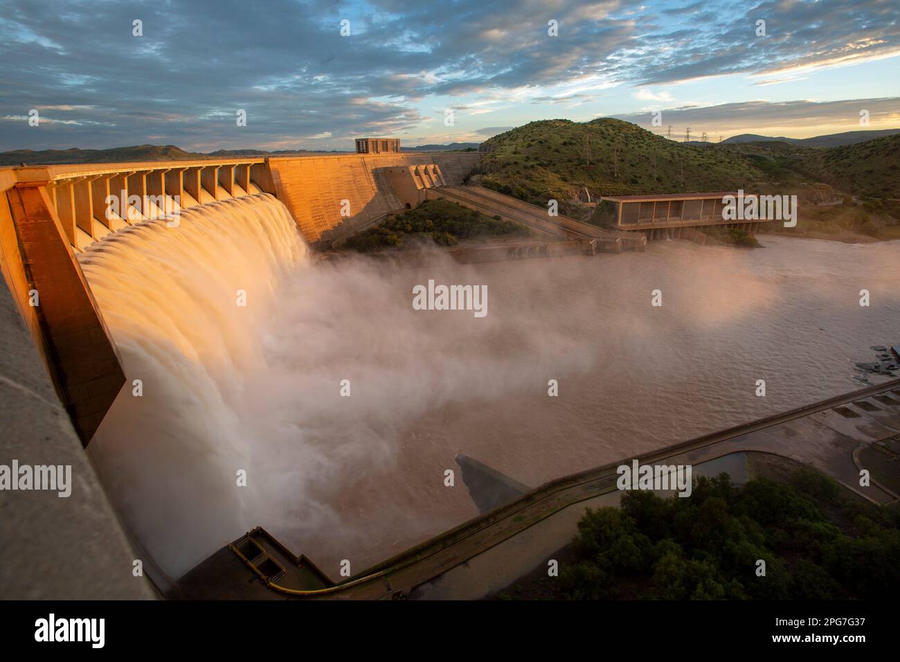 Gariep Dam and hydro-power station with water overflowing the wall as ...