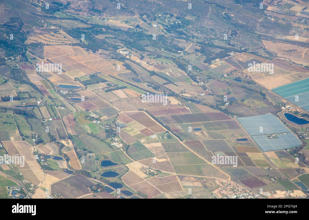 Patchwork of farmland, dams and shade-cloth covered intensive ...