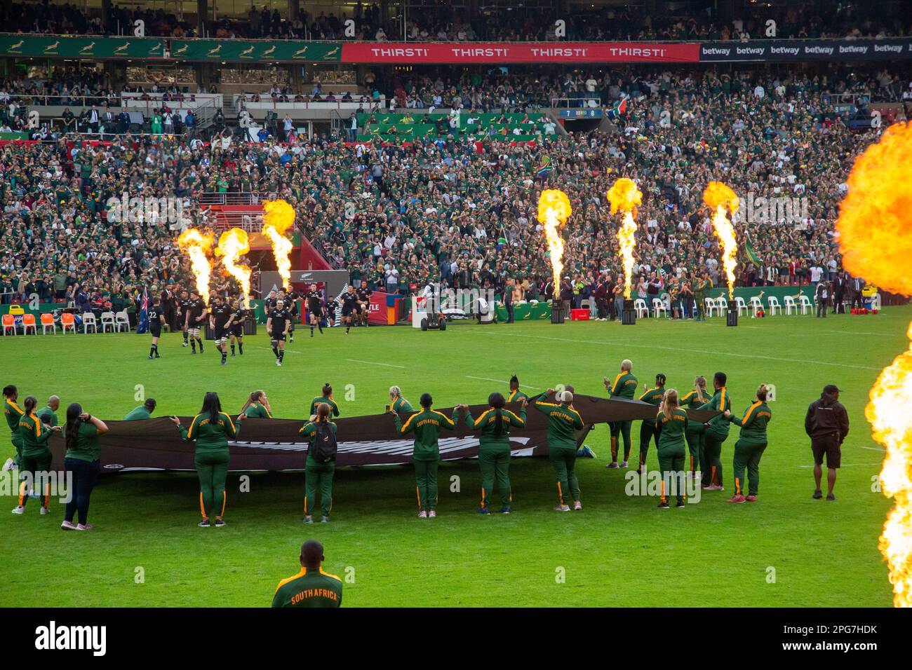 Springbok womens rugby side hold the New Zealand flag during the ...
