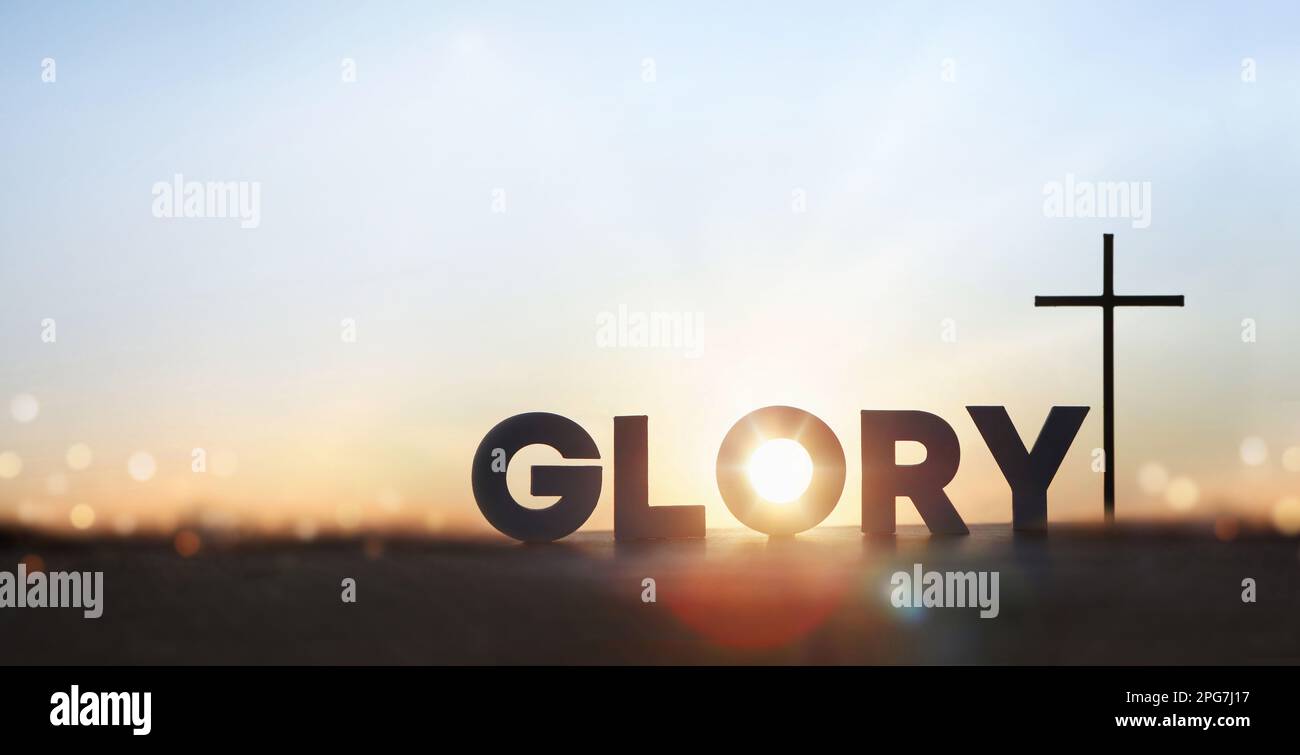 GLORY lettering with bright sunlight, the cross of Jesus Christ and ...