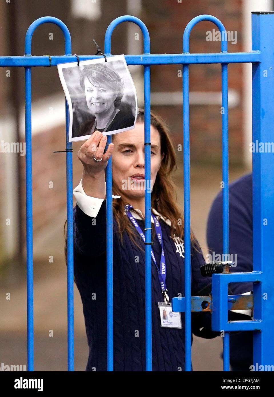 Headteacher Flora Cooper, wearing a black armband, stands next to a ...