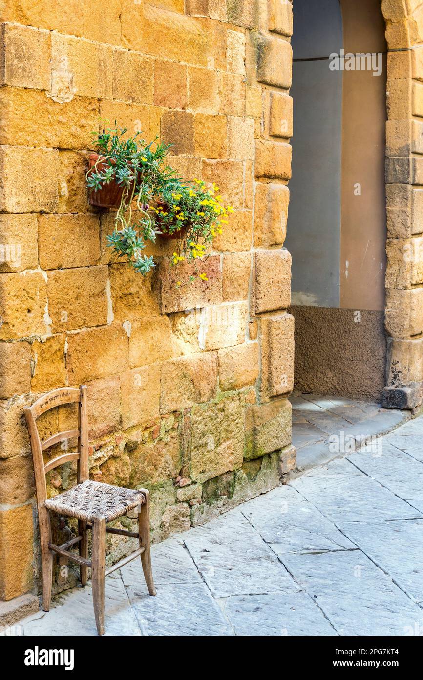 Chair in an alley for tired walkers on their pilgrimage Stock Photo - Alamy