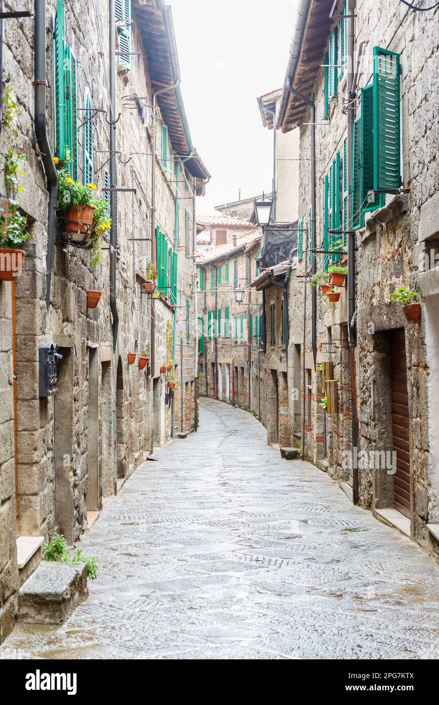 Backstreet in an old idyllic city Stock Photo - Alamy