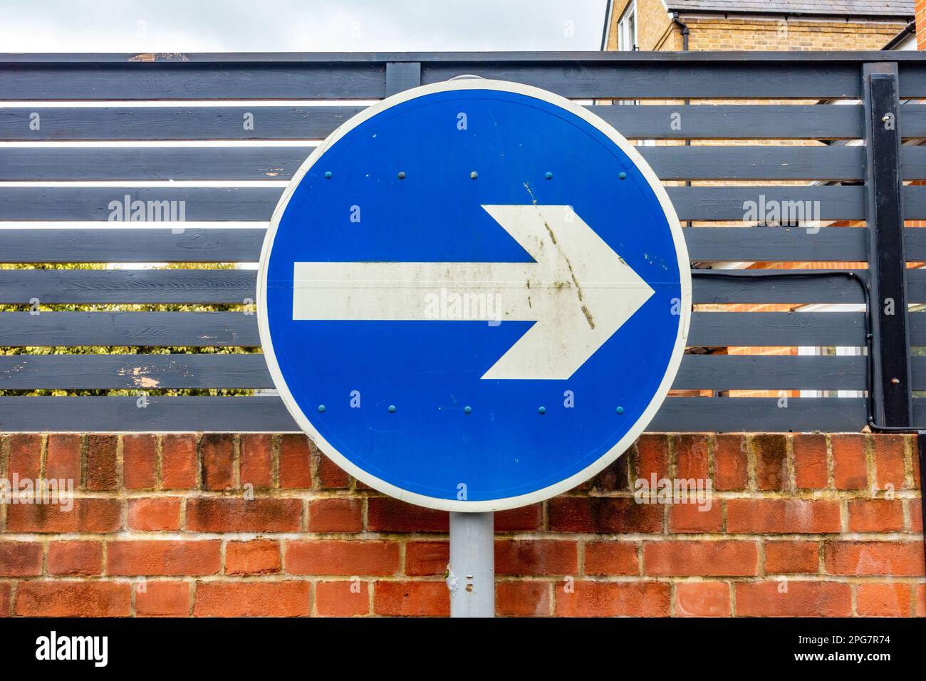 A road sign indicating direction of travel down a one way street Stock ...
