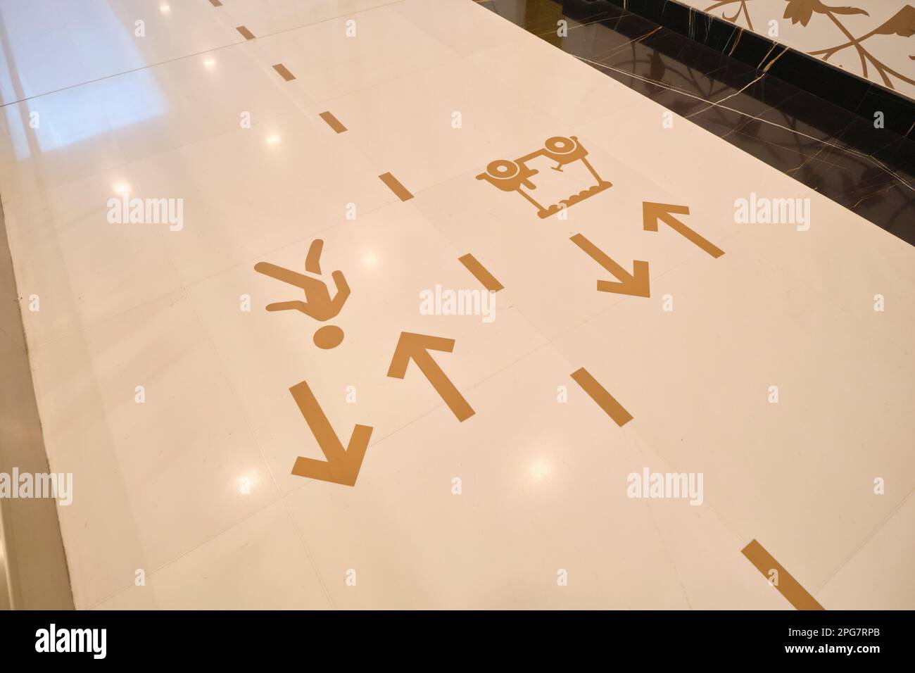 Detail of the floor signs, directions for walkers and carts along the ...