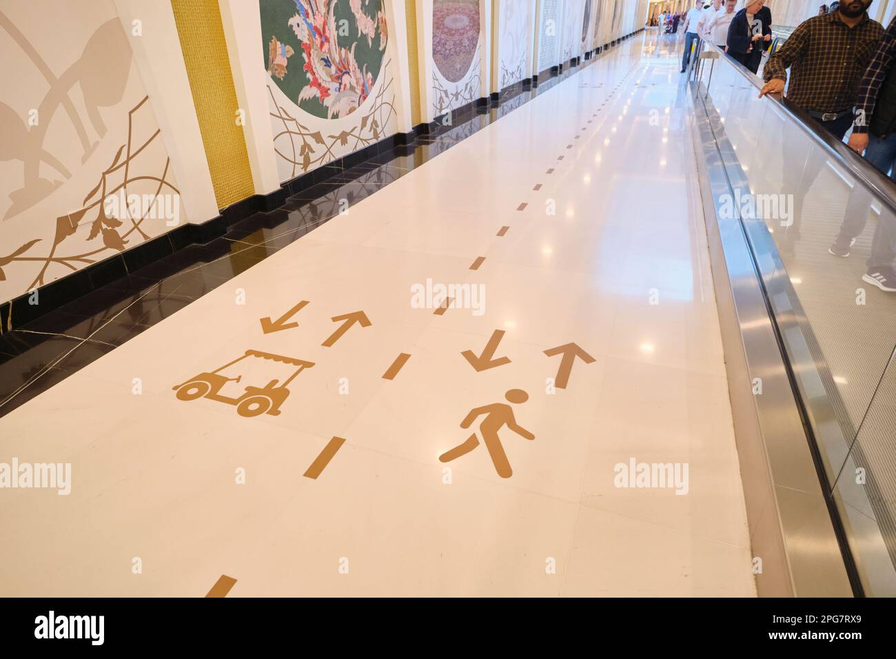 Detail of the floor signs, directions for walkers and carts along the ...