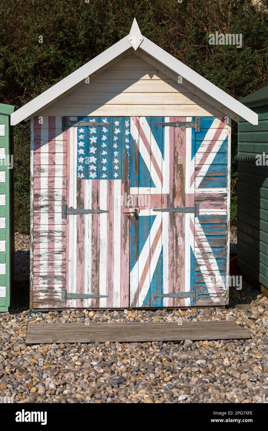 Beach hut with British Union Jack flag and American stars and stripes ...