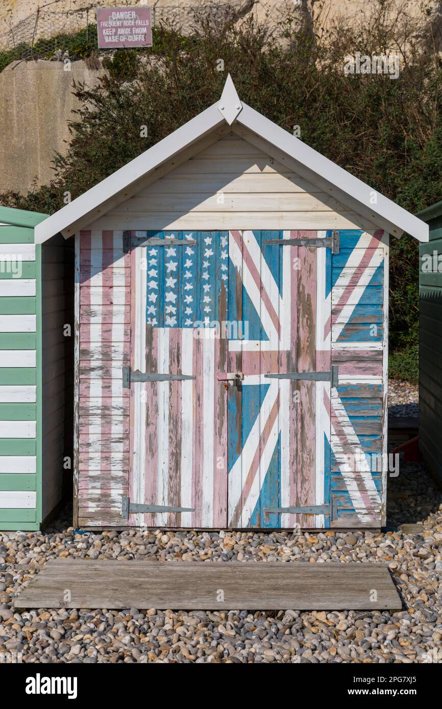Beach hut with British Union Jack flag and American stars and stripes ...