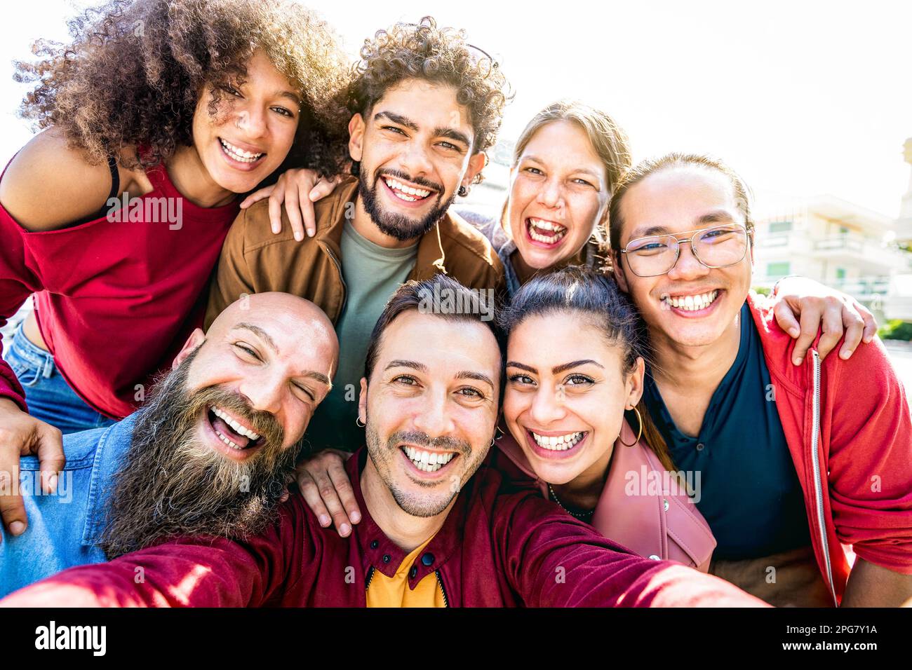 Multi cultural guys and girls taking genuine selfie outside - Happy diversity life style concept ...