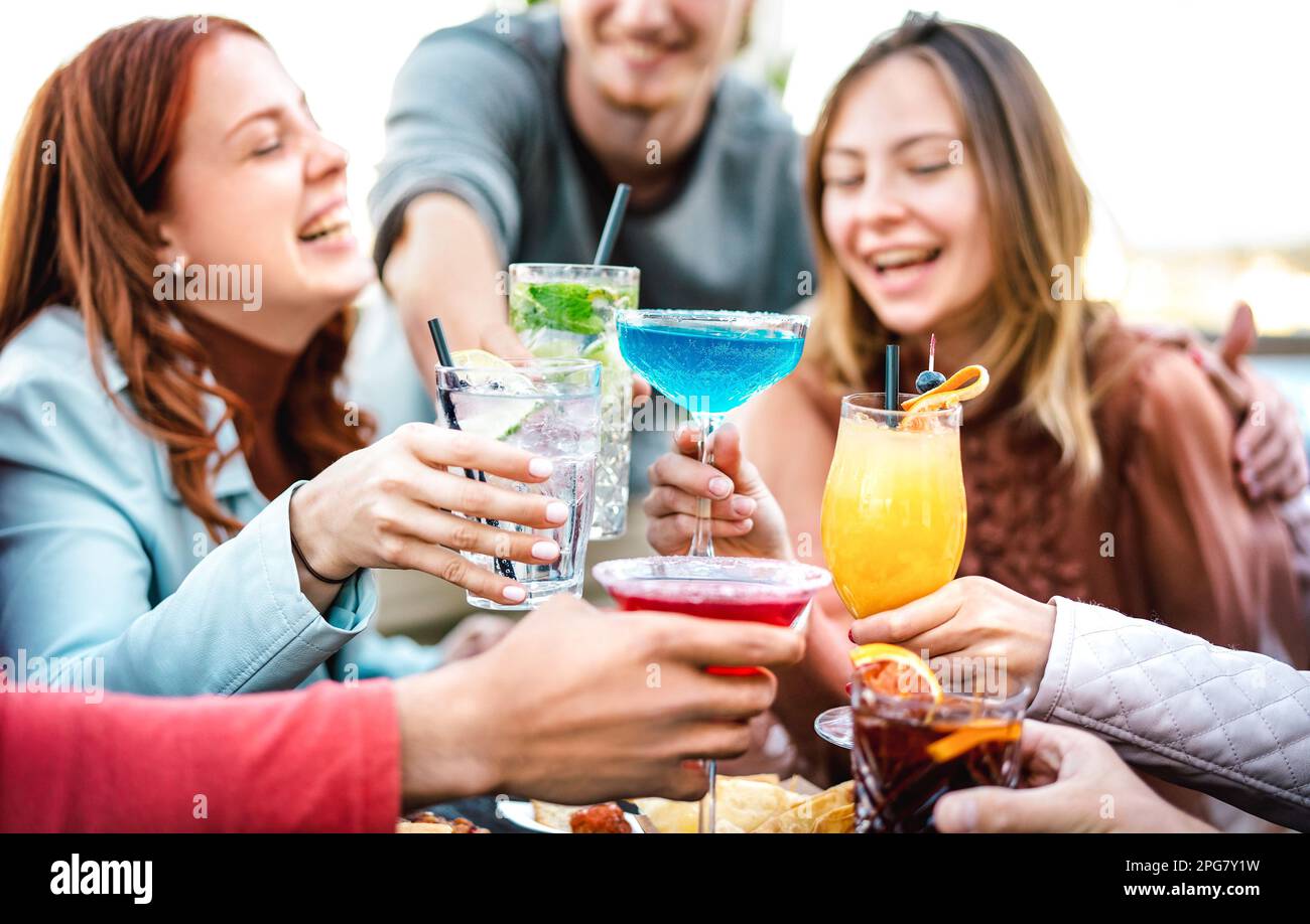 Hands toasting with cocktails hi-res stock photography and images - Alamy