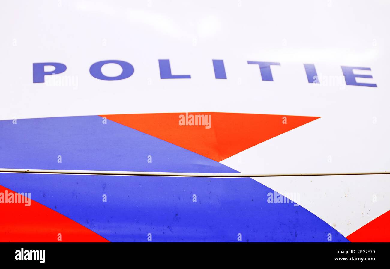 Logo and striping of the Dutch police (politie) on patrol car in the ...