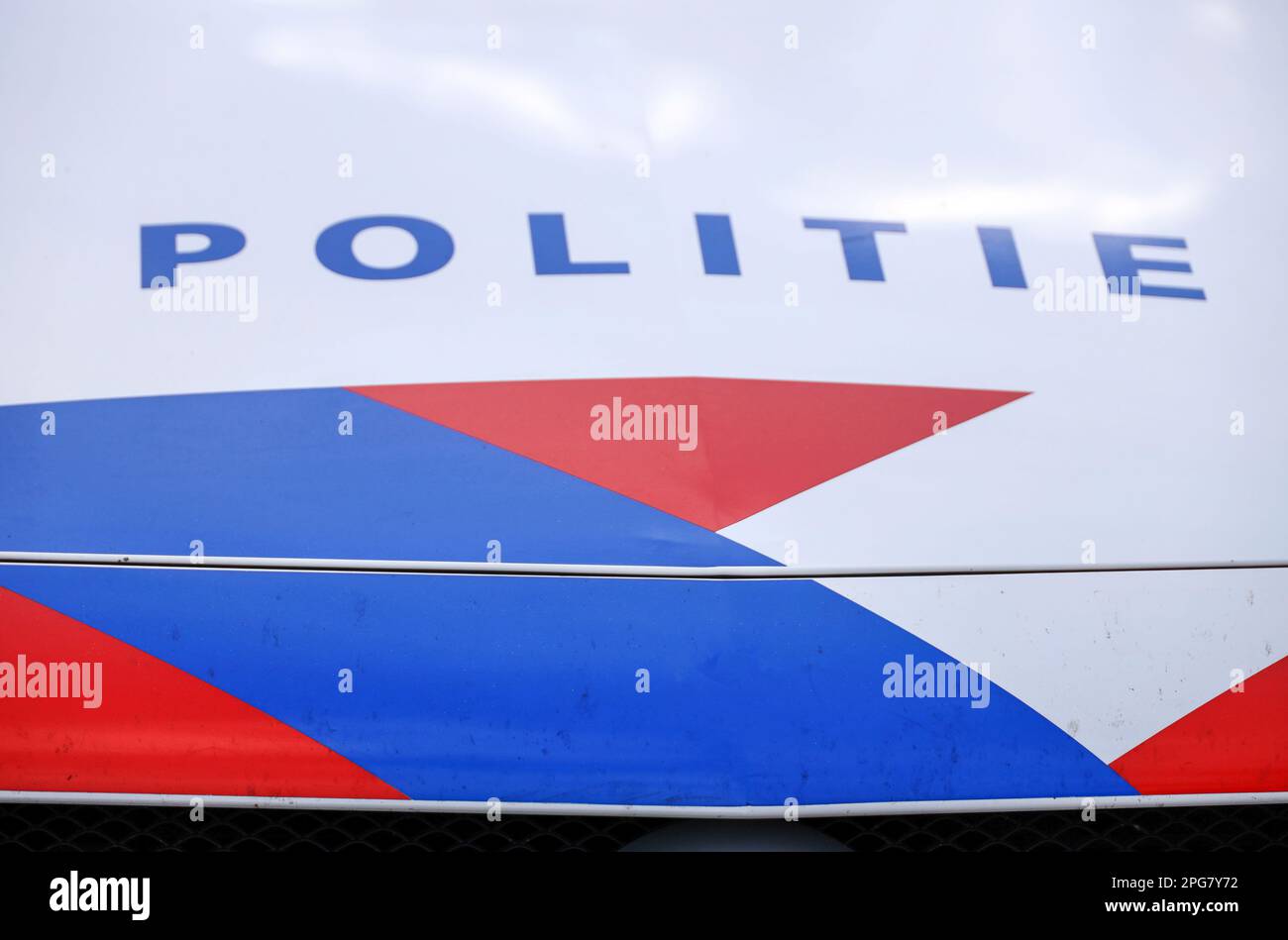 Logo and striping of the Dutch police (politie) on patrol car in the ...