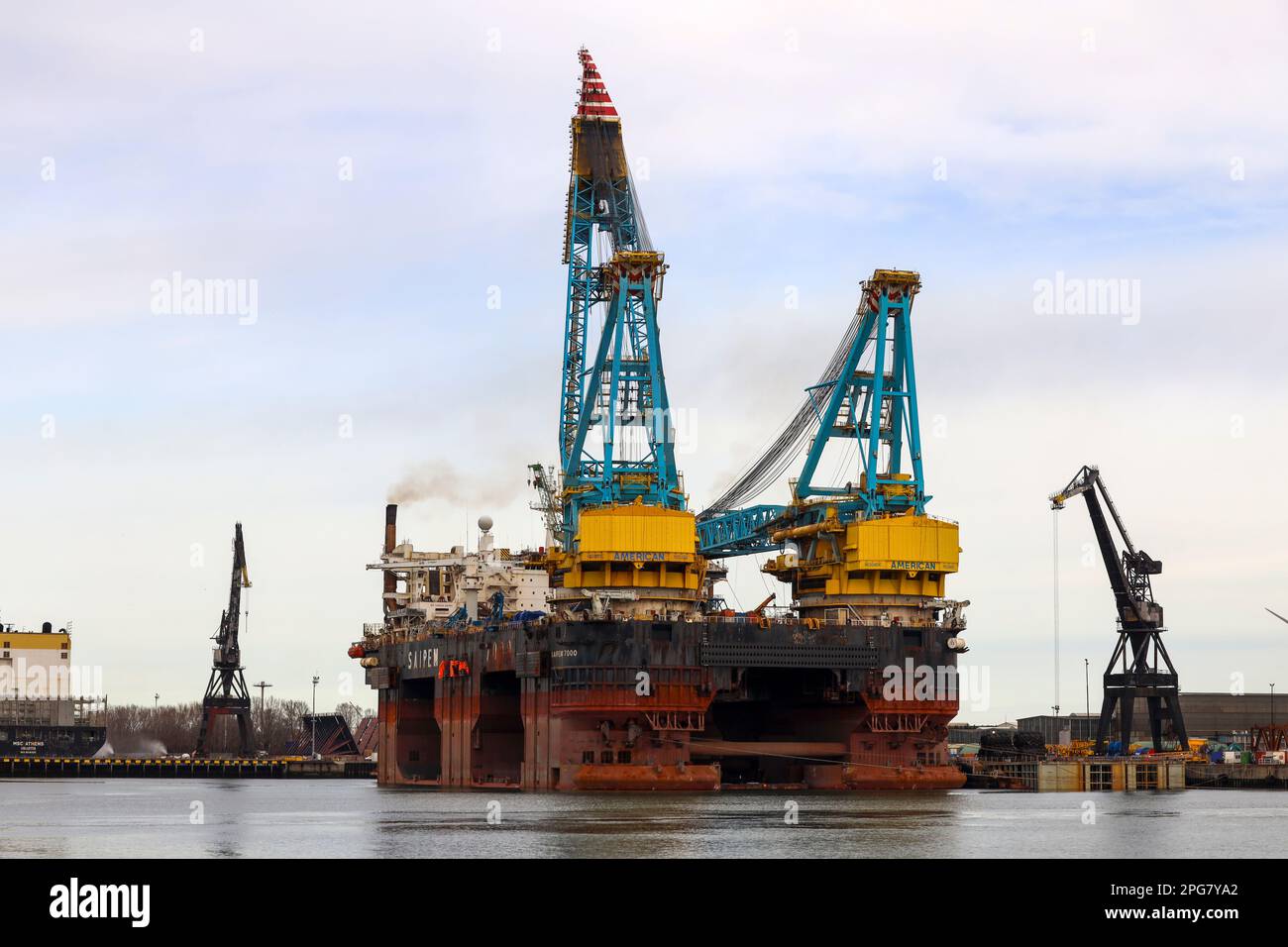 Saipem heavy duty crane ship is moored at the Pernis Harbor in the port ...