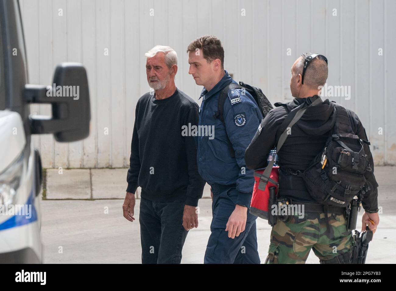 David Hunter (left), from Northumberland, is led back to a police van ...