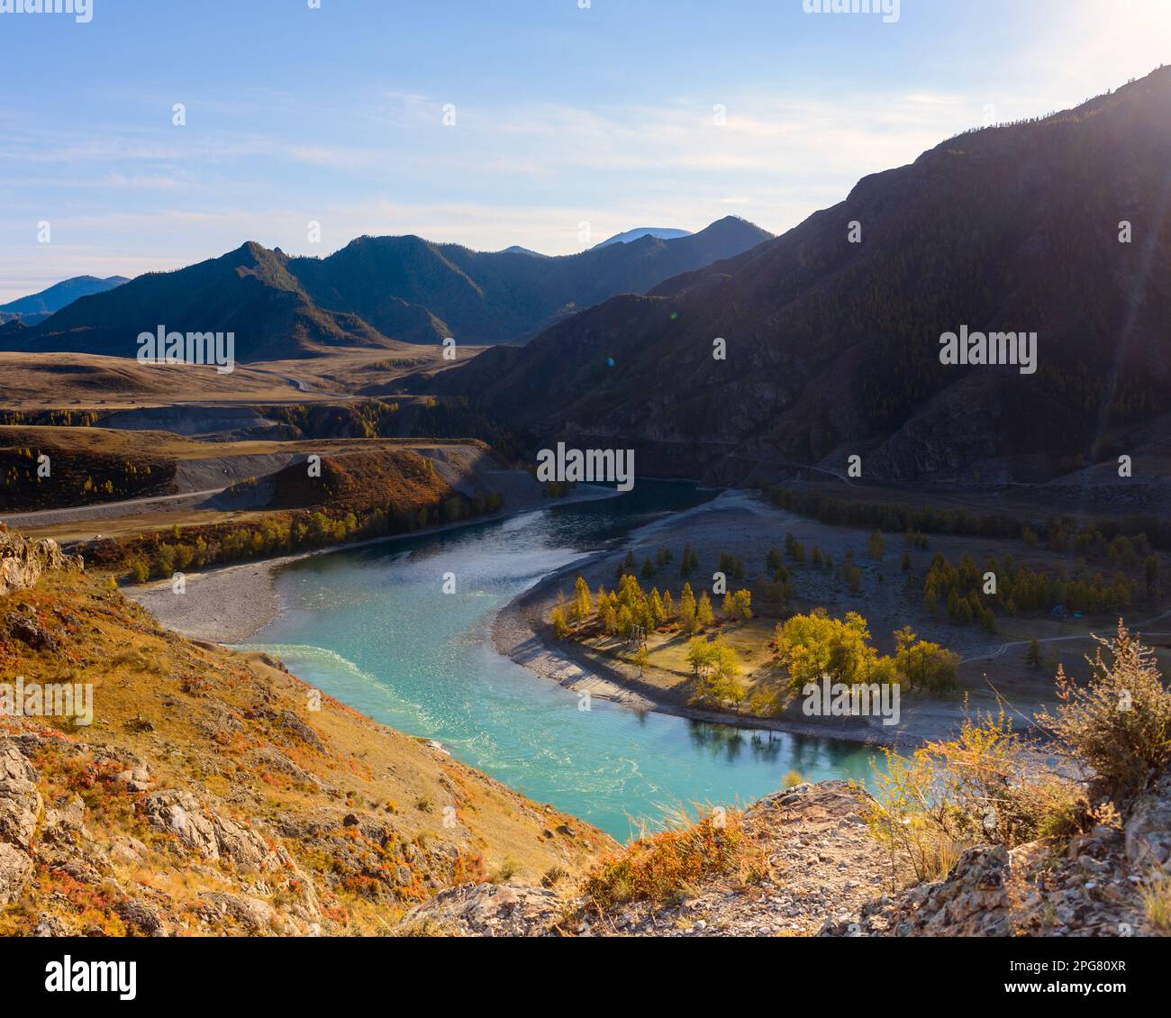 The confluence of two mountain rivers Chuya and Katun under a rock with ...