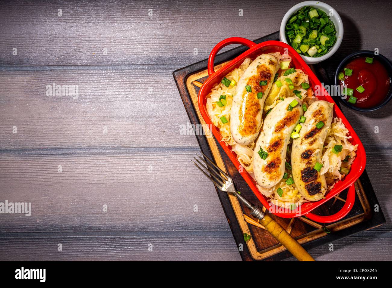 White fried Munich, wurst sausages with fried cabbage or sauerkraut ...