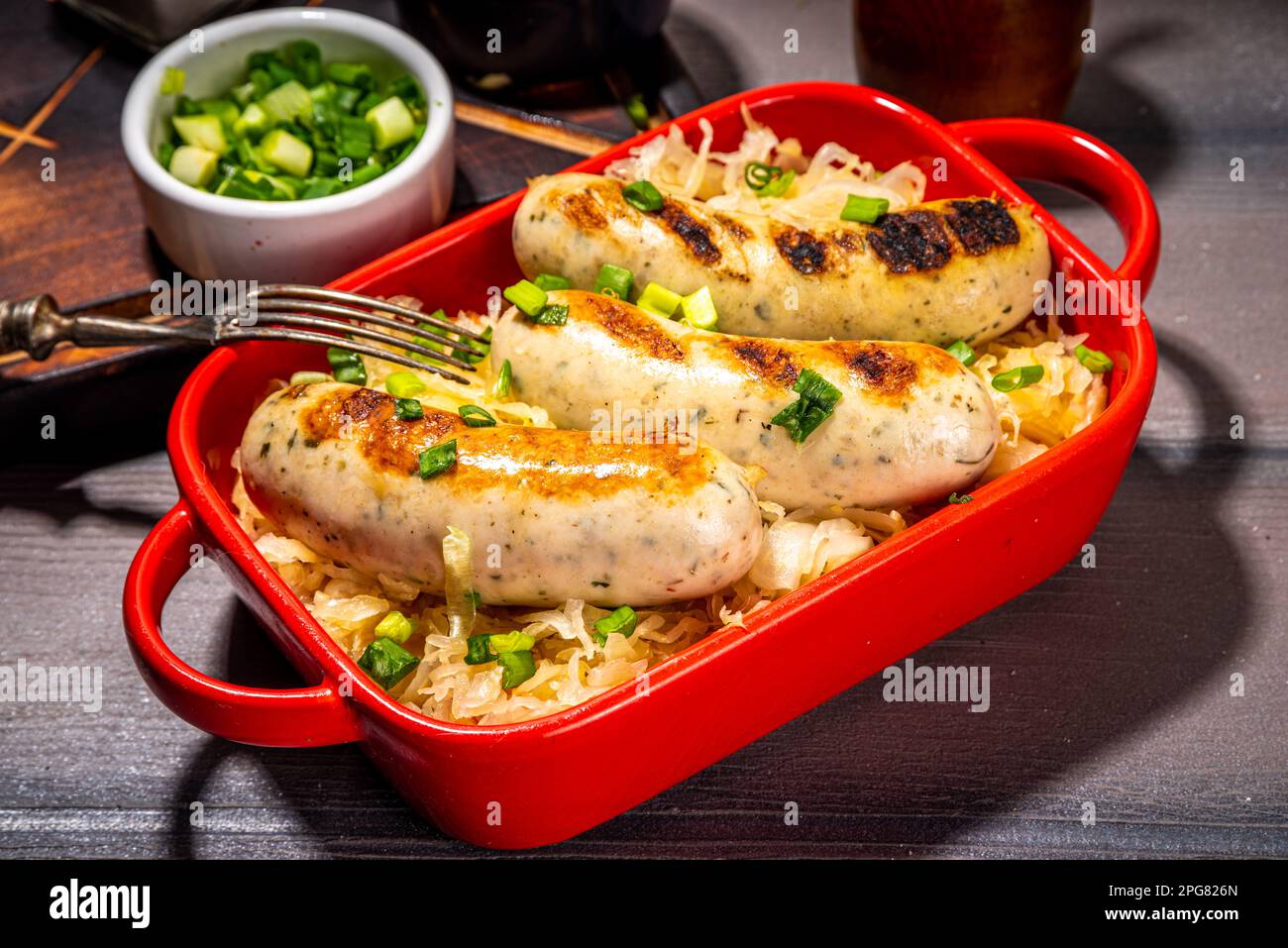 White fried Munich, wurst sausages with fried cabbage or sauerkraut ...