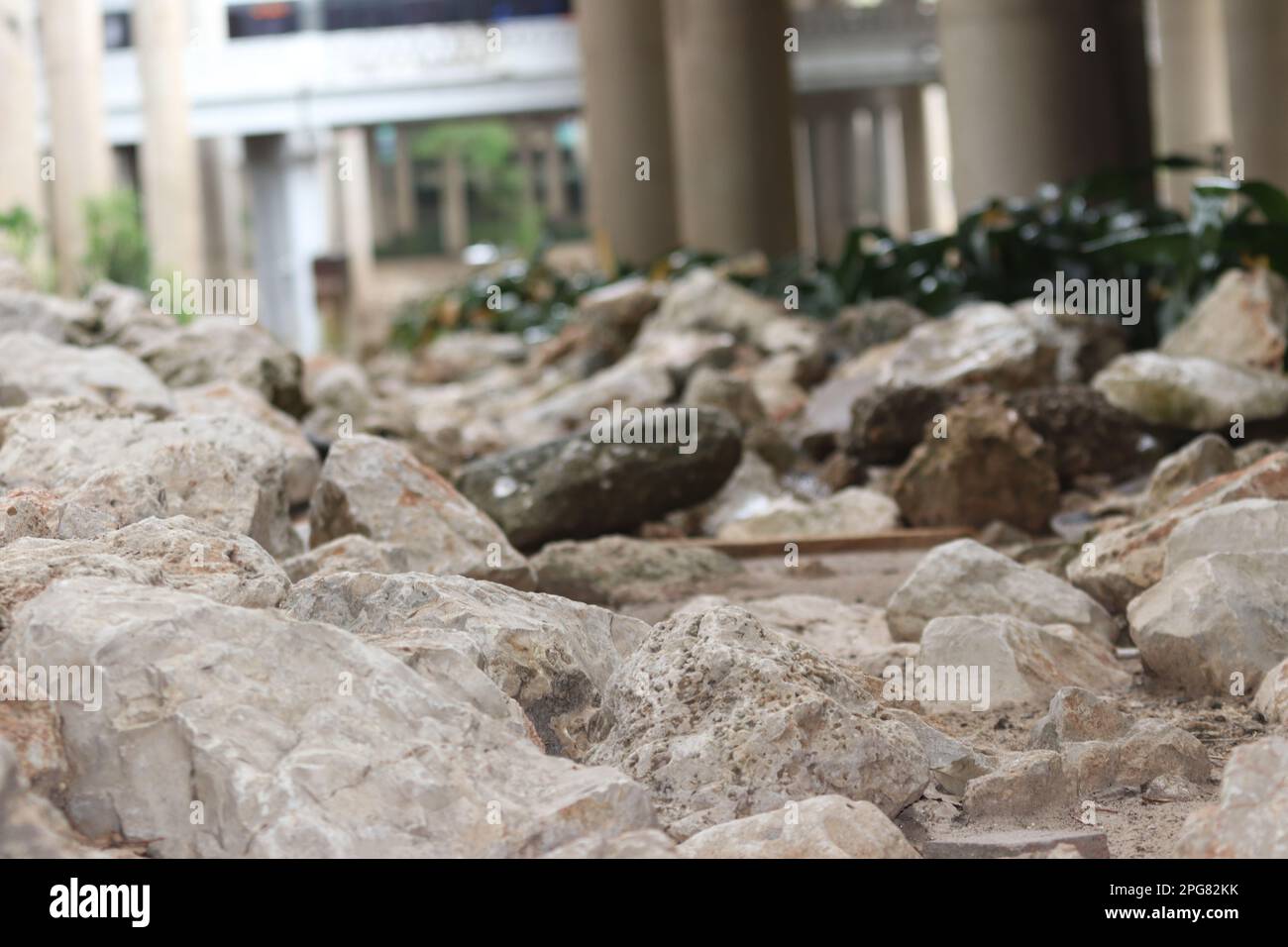 An outdoor scene featuring an array of assorted shaped rocks scattered ...
