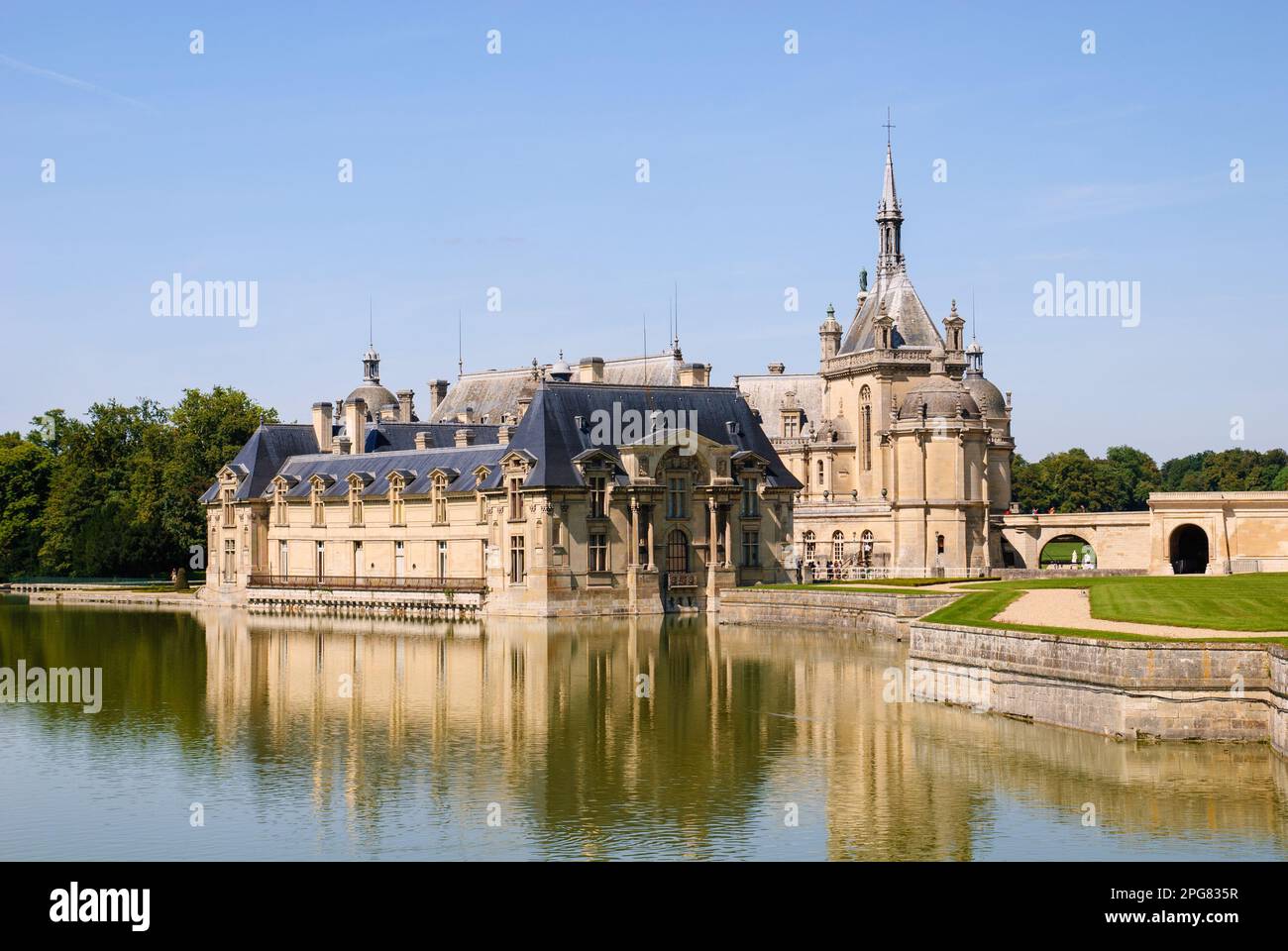 Chantilly Castle in France, with water reflections Stock Photo - Alamy