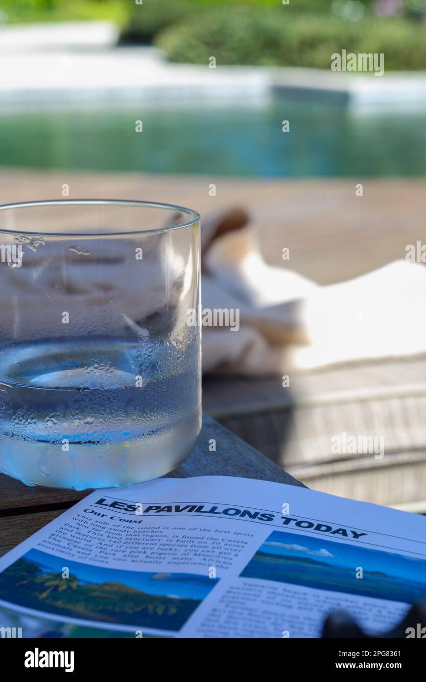 Water Glass on the table next the Hotel pool Stock Photo - Alamy