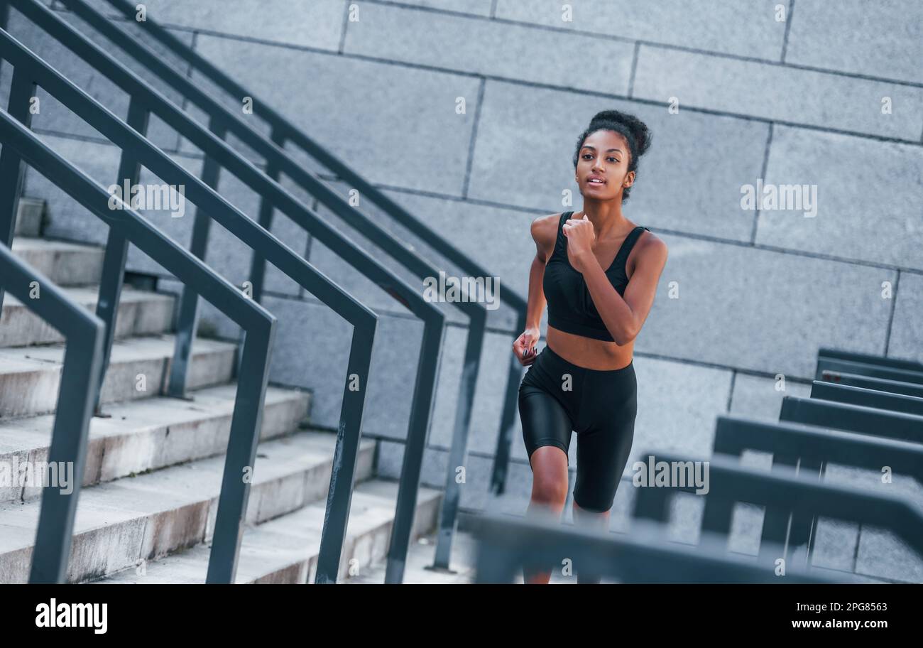 Active runner. Young african american woman in sportive clothes have ...