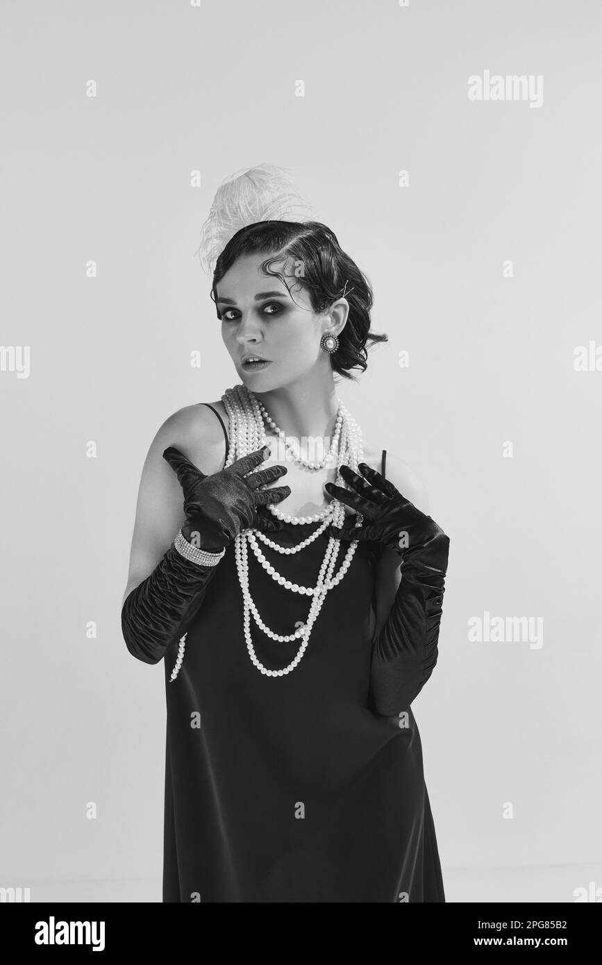 Photo of vintage dressed woman wearing old-time clothes standing and ...