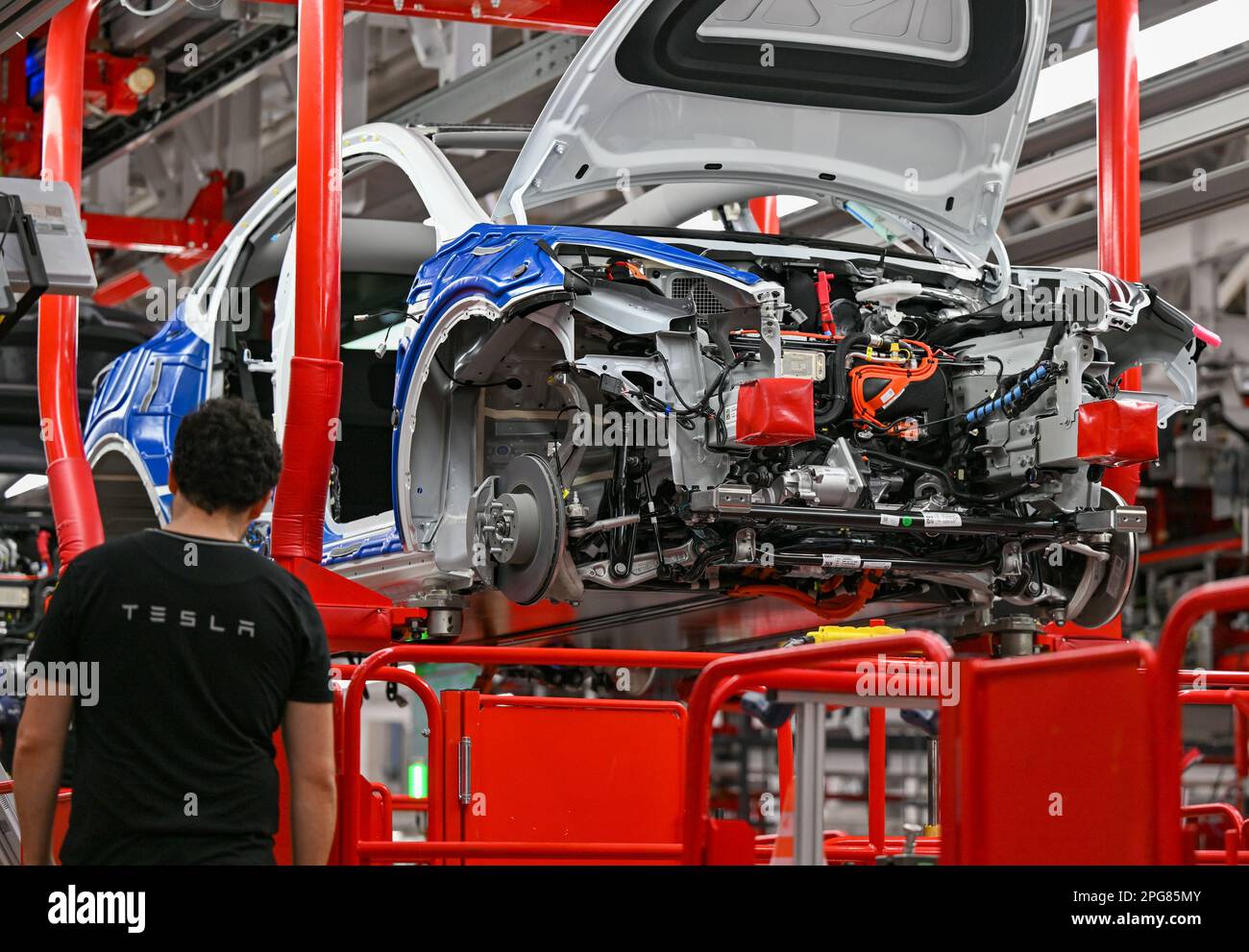 20 March 2023, Brandenburg, Grünheide: Employees of the Tesla ...