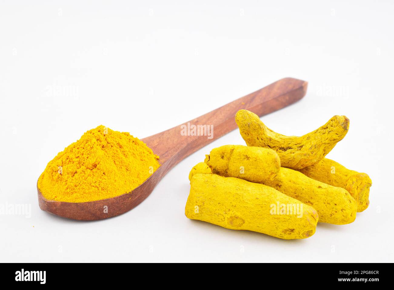 Raw turmeric with powder isolated on white background Stock Photo - Alamy