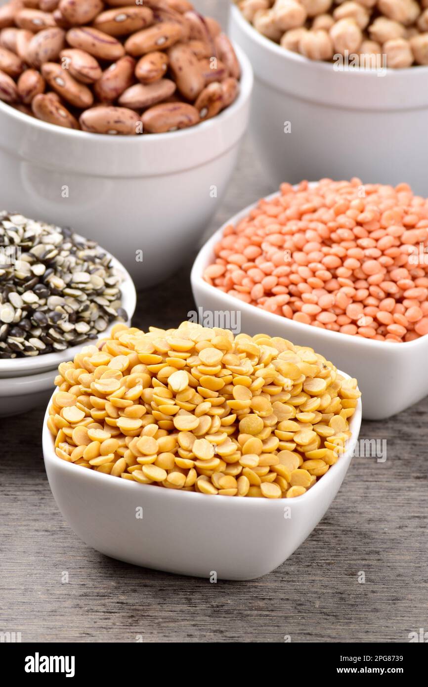Chana dal in bowl with variety of legumes in background Stock Photo - Alamy