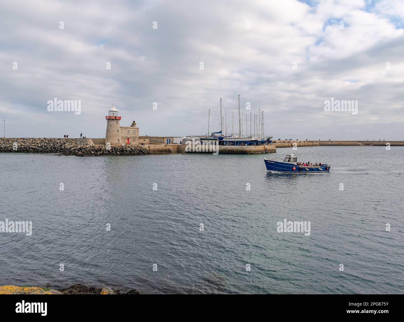 Tourist Boat Agnes Olibhear passing Howth Lighthouse on the East Pier ...