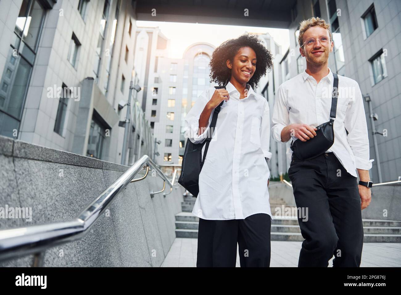 Man with afrian american woman together in the city outdoors Stock ...