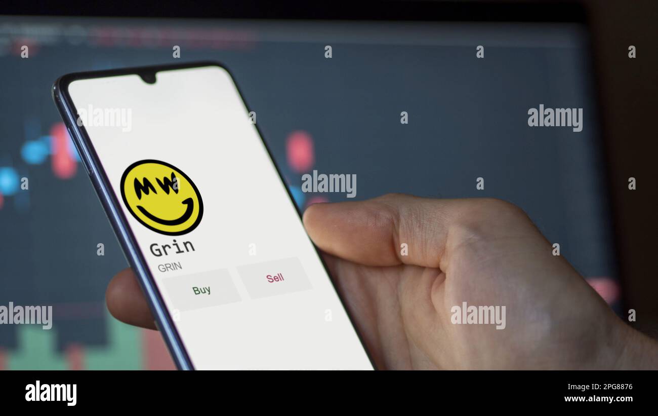 March 11 2023 London UK. An investor's analyzing the Grin coin on ...