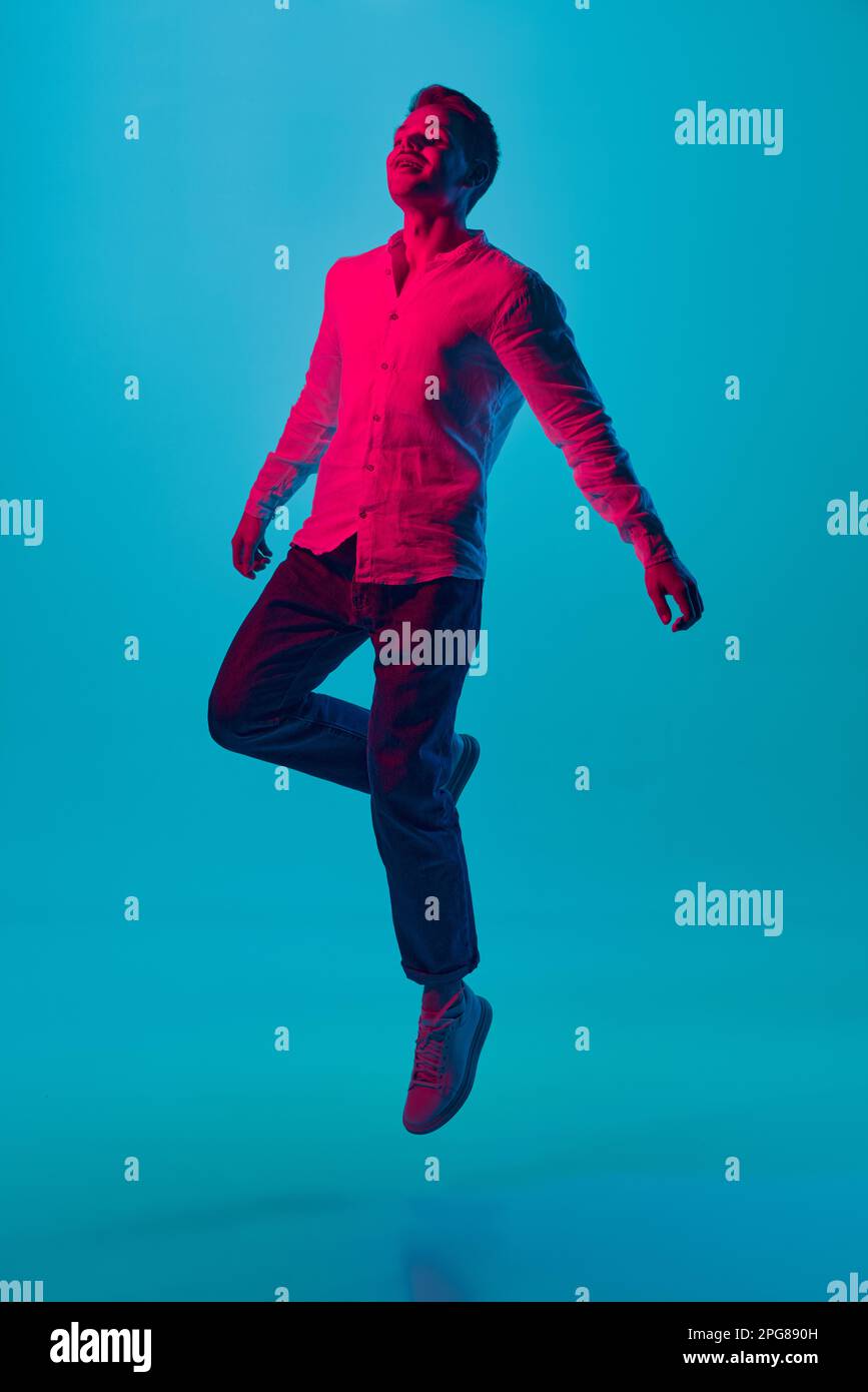 Calm, happy and delightful. Full-length portrait of young positive man ...