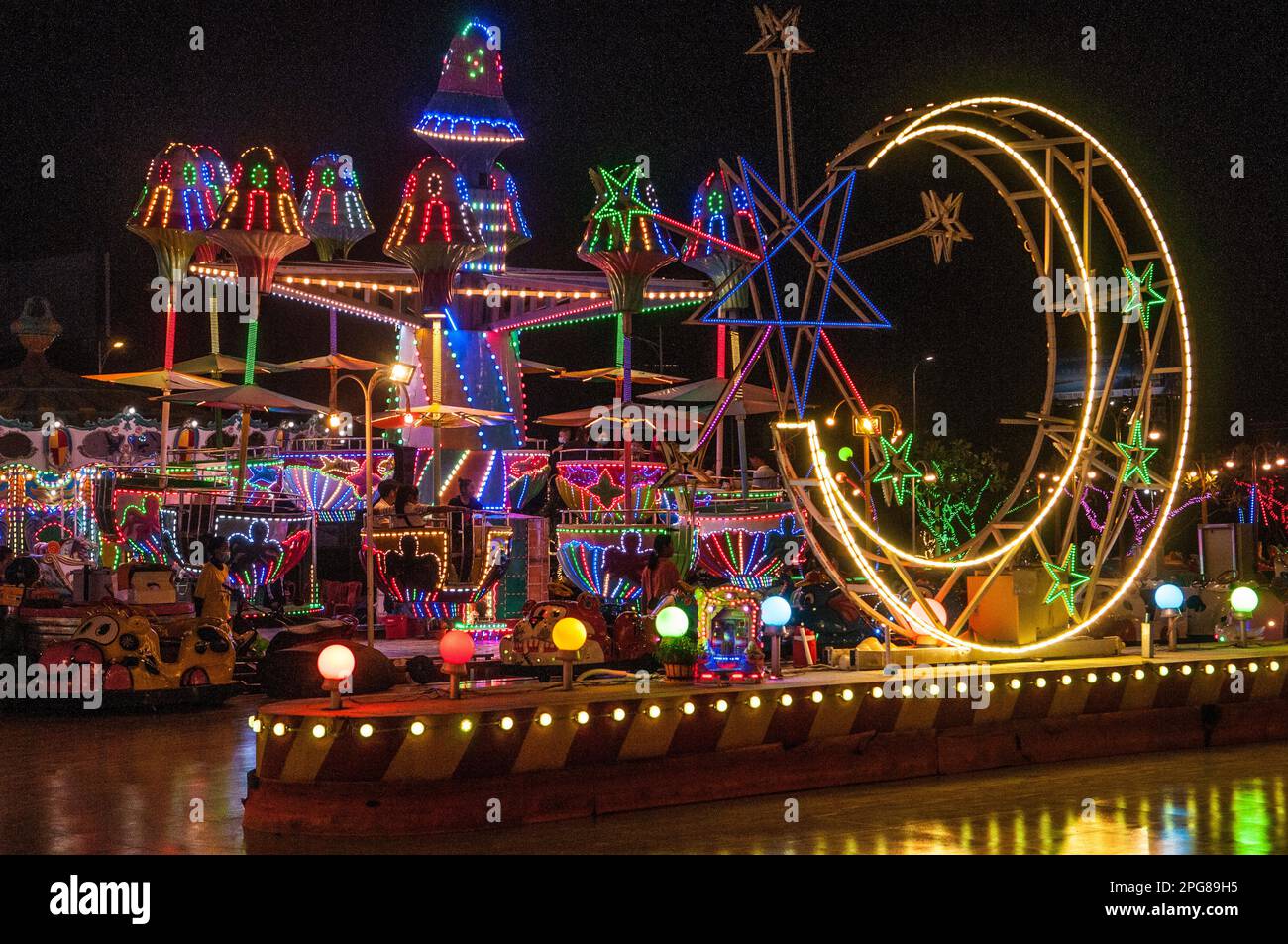 an almost empty Phnom Penh Fantasy World amusement park lit up for ...