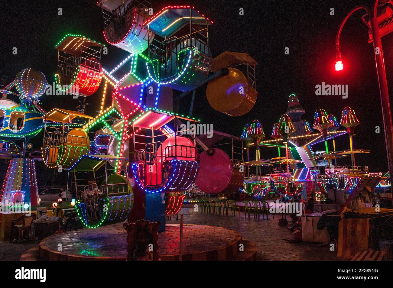 an almost empty Phnom Penh Fantasy World amusement park lit up for ...