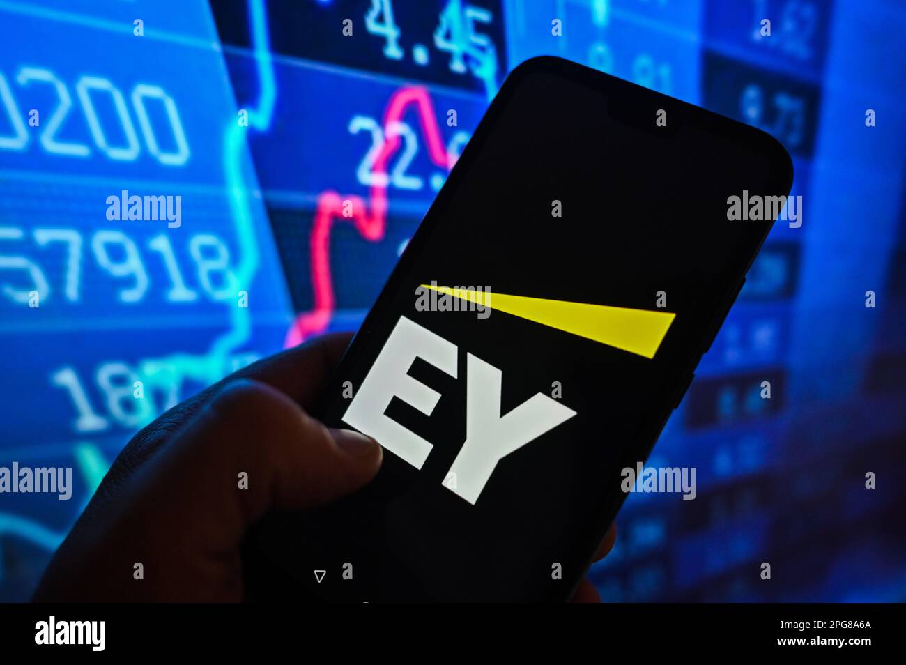 In this photo illustration, an EY logo is displayed on a smartphone ...