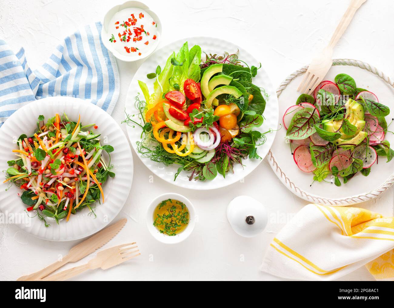 Various healthy salads of fresh vegetables,fruits and microgreens on ...