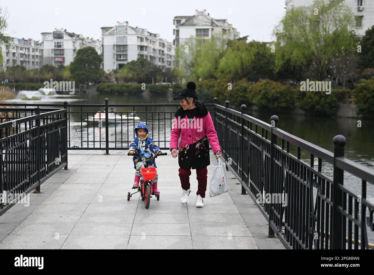 Hangzhou, China's Zhejiang Province. 16th Mar, 2023. People walk on a ...