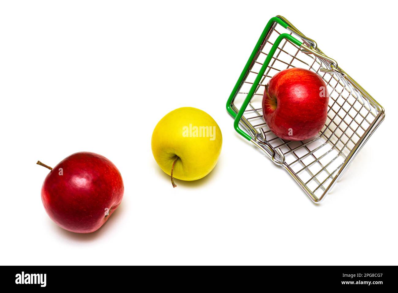 multi-colored apples rolled out of the basket. red and green apple on ...