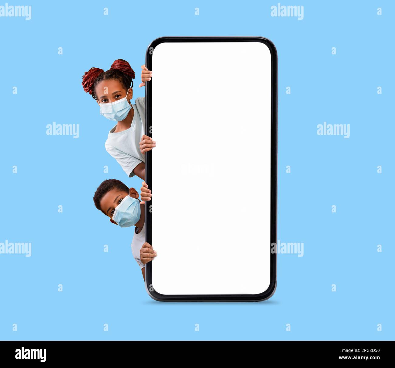 Two black kids wearing medical masks peeking out behind big blank ...