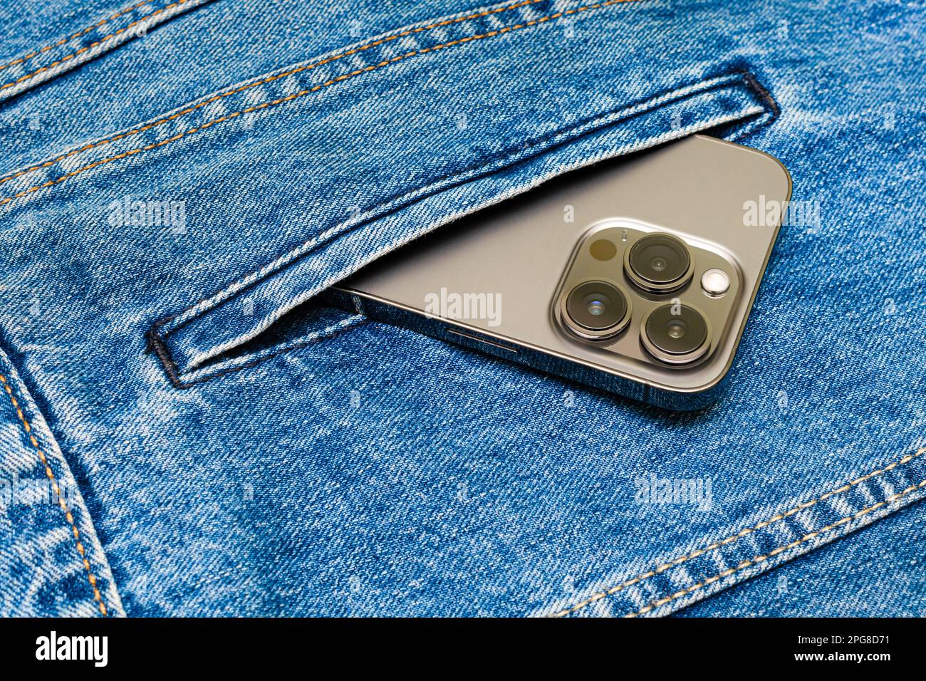 modern phone peeking out of jeans pocket. phone in pocket Stock Photo ...