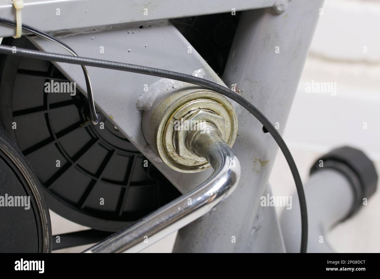 Elements of an exercise bike. Rod bearing. Close-up Stock Photo - Alamy
