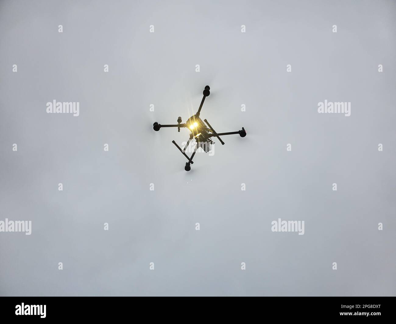 An aerial view of an unmanned aerial vehicle (UAV) flying in the sky on ...